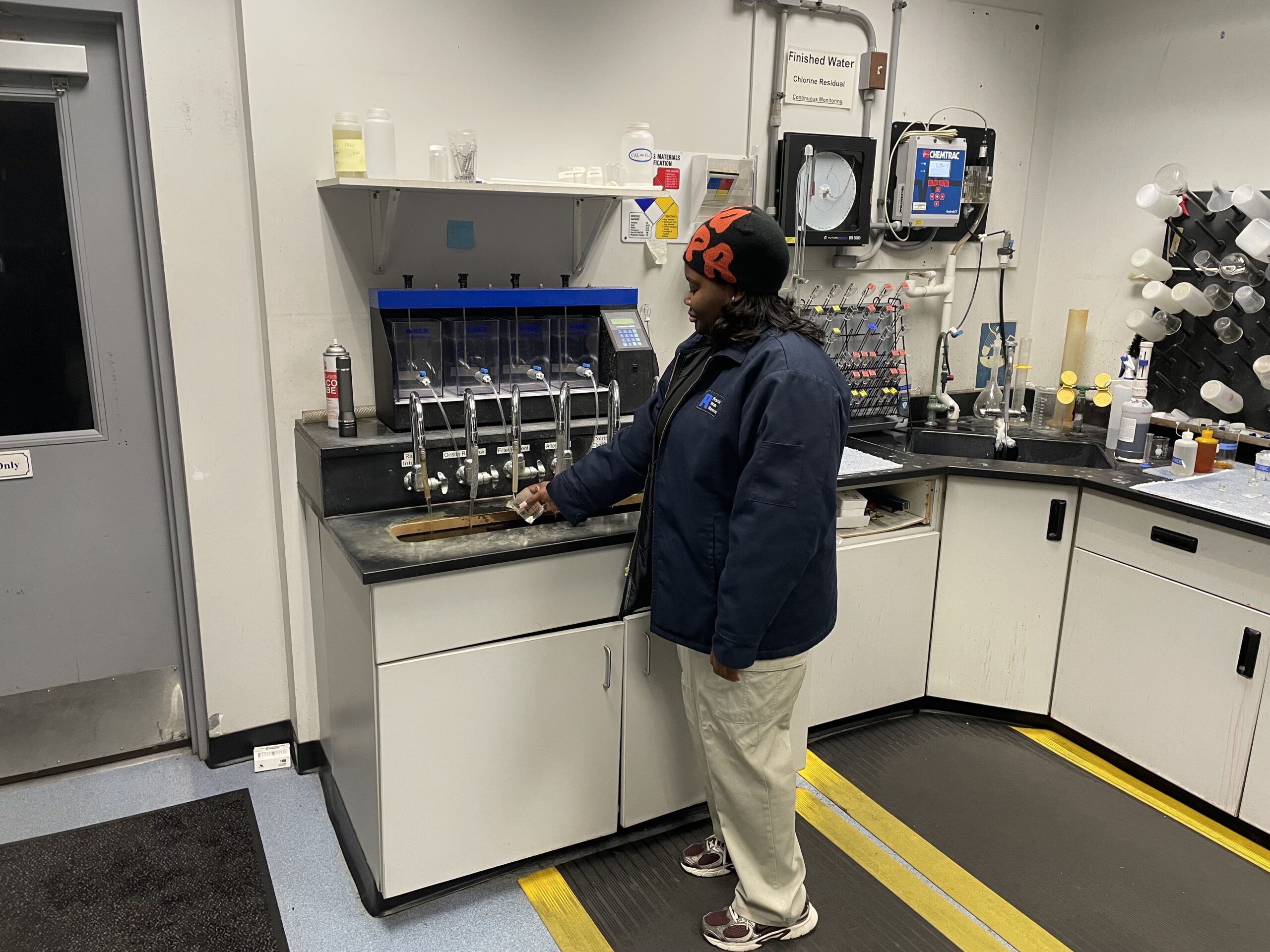 Class III Operator Tiandria Cotton Collecting a Water Sample for ...